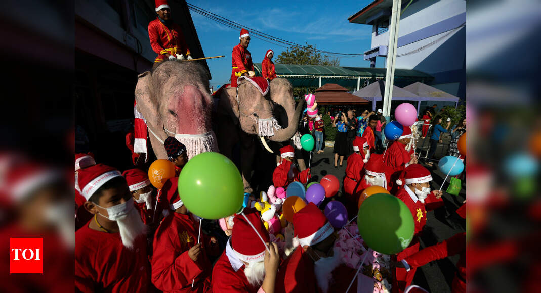 Christmas Celebration: Santa Claus comes to town riding an elephant in ...