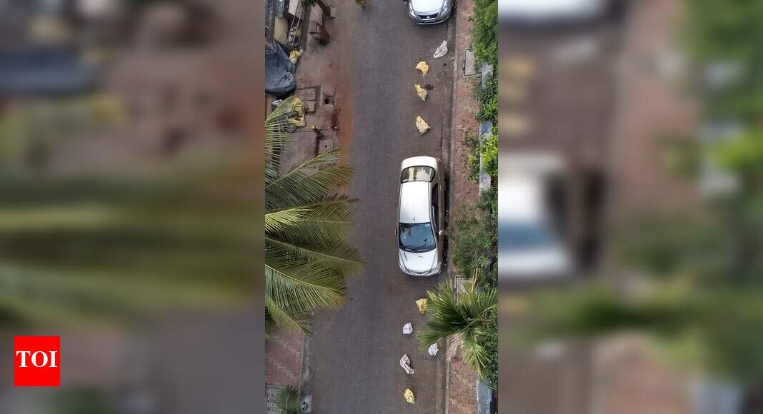 Illegally blocked parking space on public road - Times of India