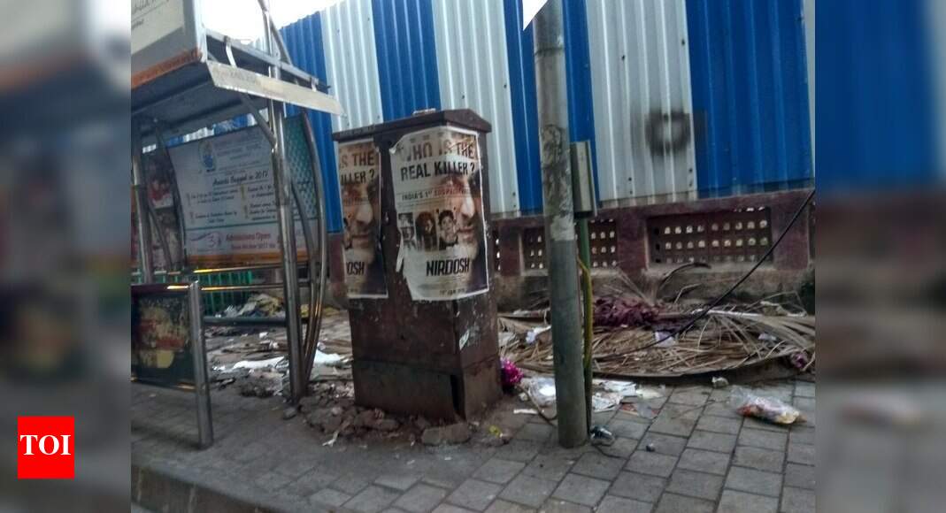 Garbage behind bus stop - Times of India