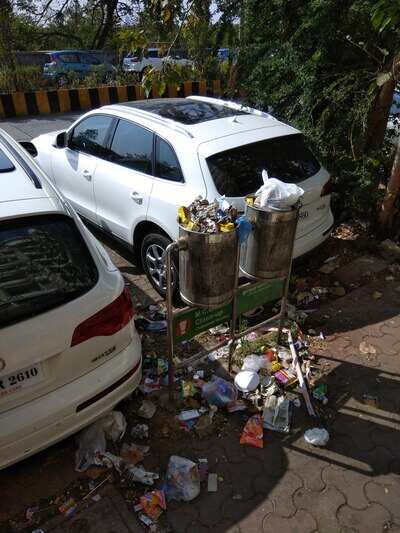 Overflowing Dustbins. - Times of India