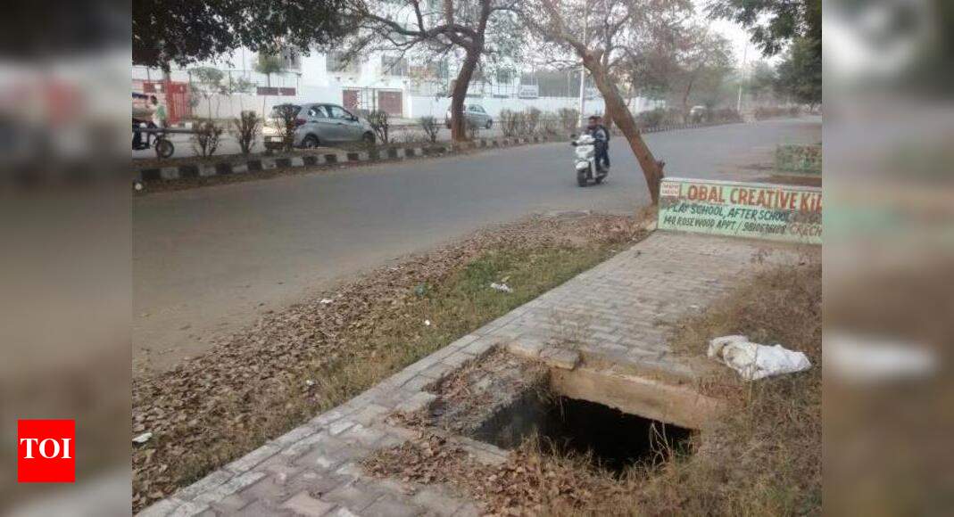 Open drains on footpaths all over Dwarka - Times of India