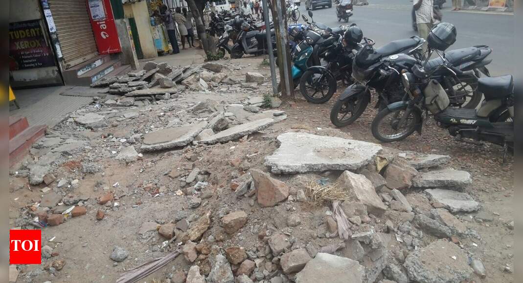 Broken footpaths - Times of India