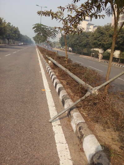 Electricity pole lying on central verge - Times of India