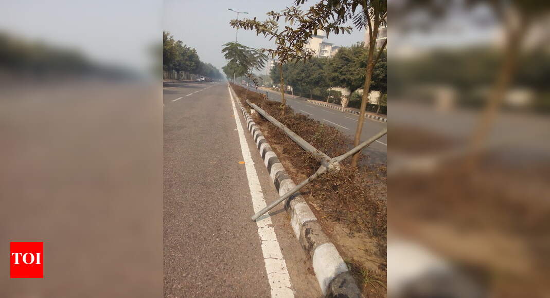 Electricity pole lying on central verge - Times of India