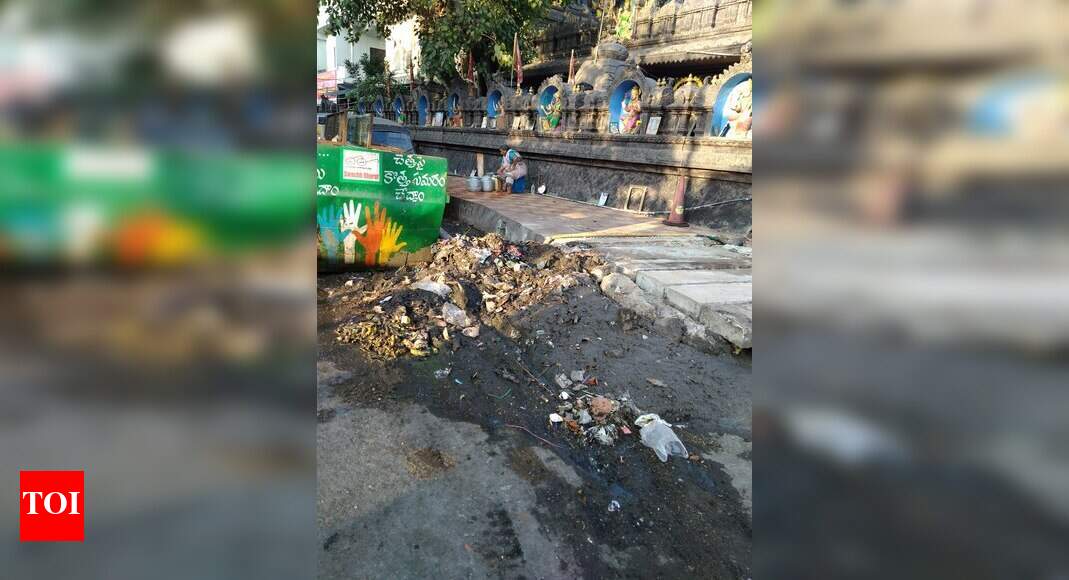 Trash next to temple - Times of India