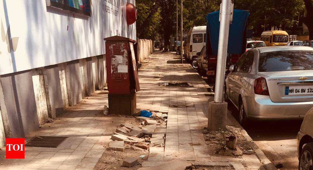 public footpath in bad shape - Times of India
