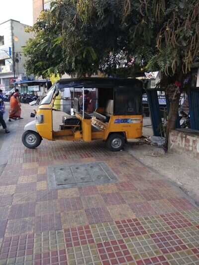 Auto stand on foot path - Times of India