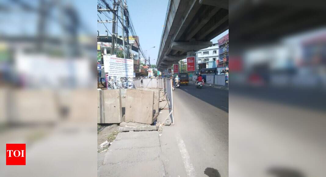 Blocking walk ways - Times of India