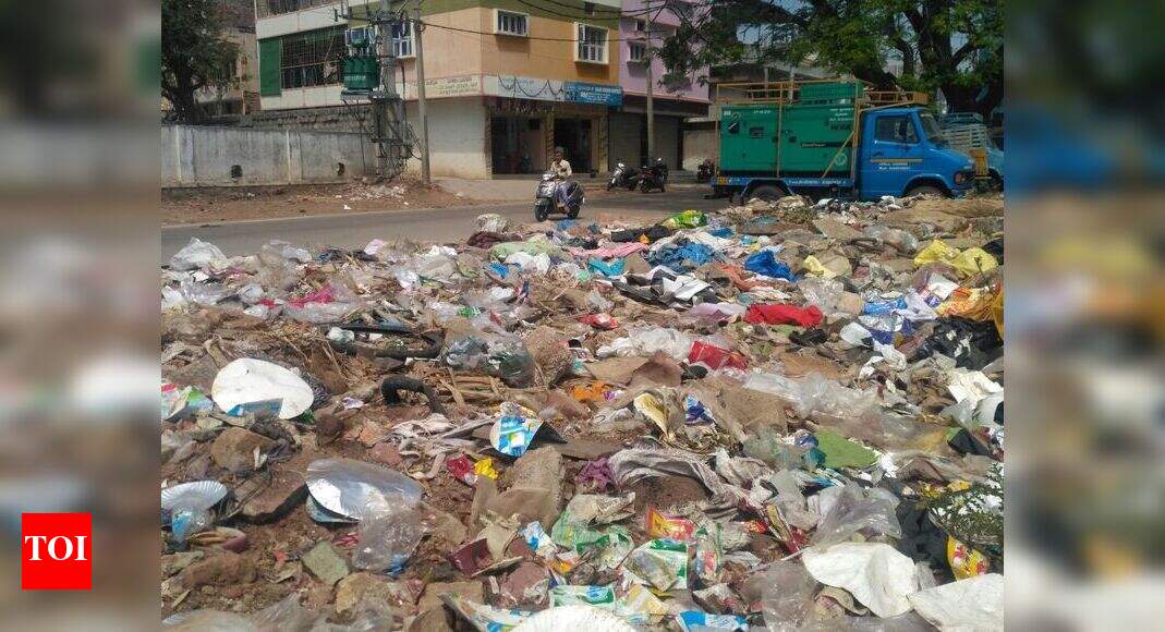 shopkeppers throw garbage ware in open space. - Times of India