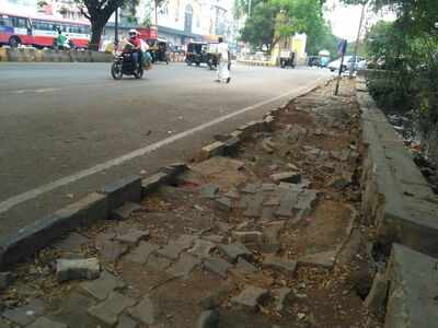 footpath in pathetic condition - Times of India