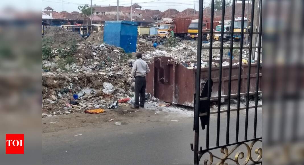 giant size dustbin occupying the road - Times of India