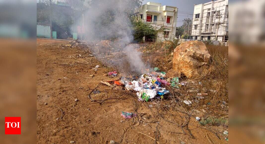 Garbage burning by Corporation workers - Times of India