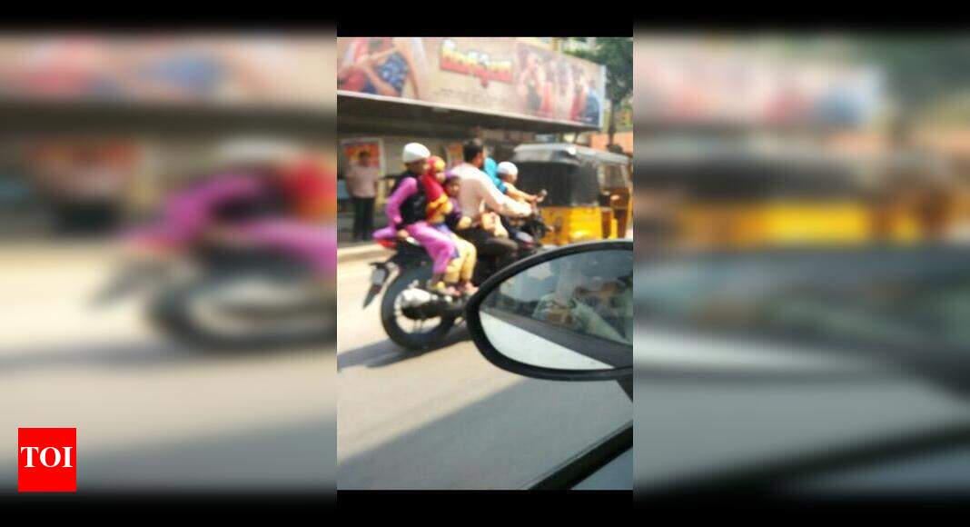 driving without helmet with 5 kids - Times of India
