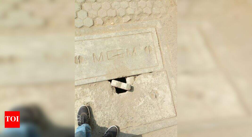 damaged footpath - Times of India