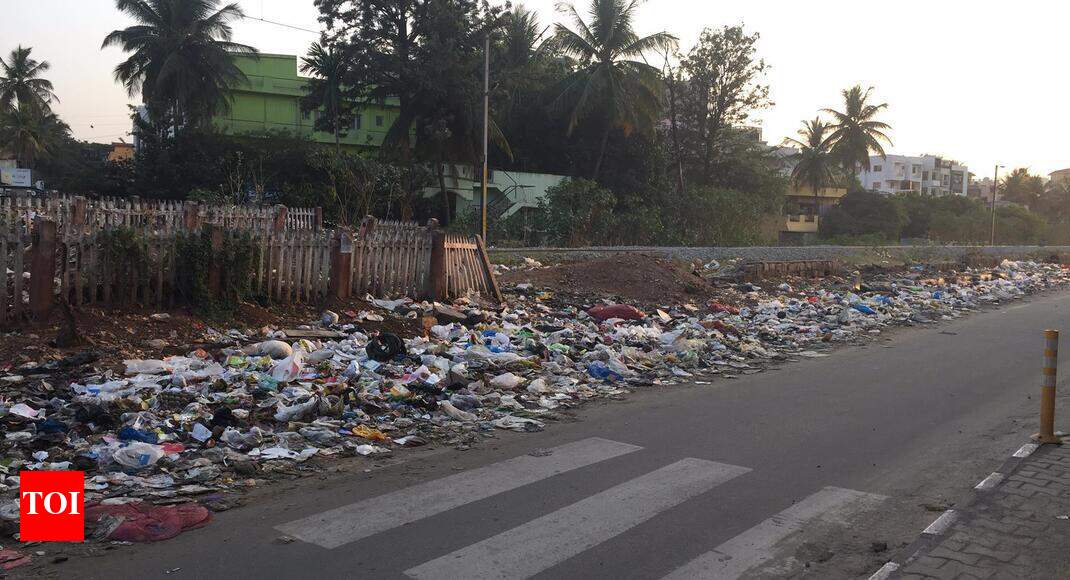 garbage scattered on roads & footpath - Times of India