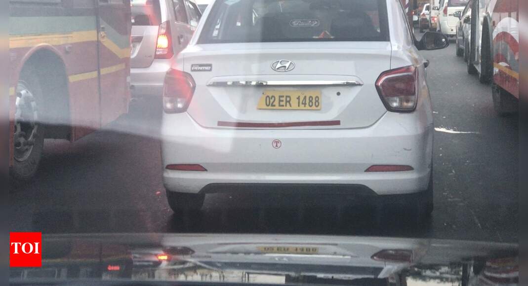 Broken Number Plate near Goregaon Highway - Times of India