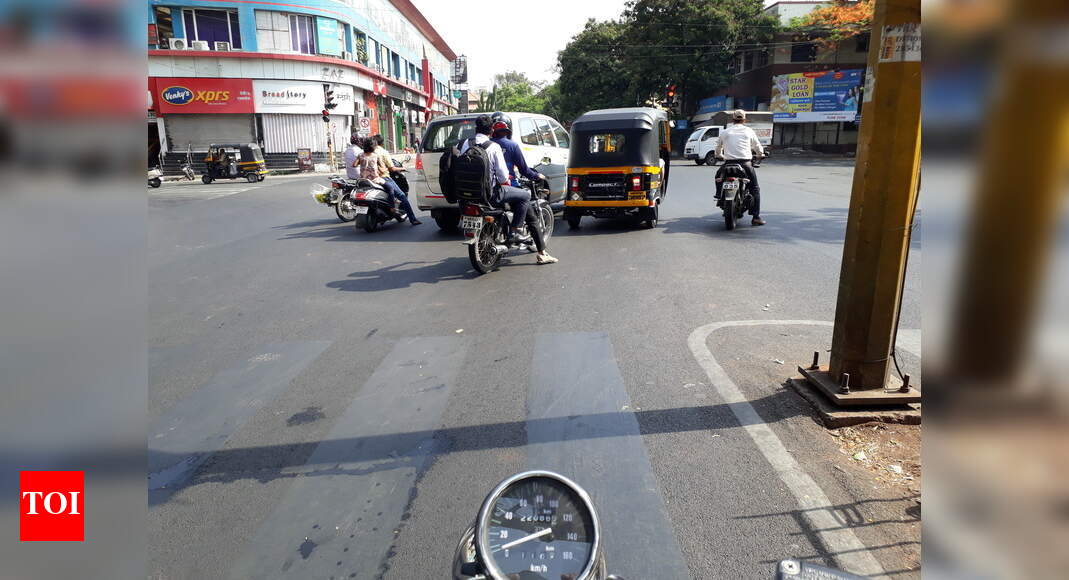 Crossing red light - Times of India