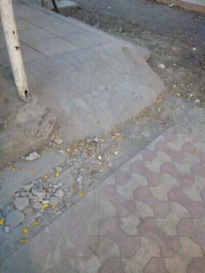 Unsafe footpath. - Times of India