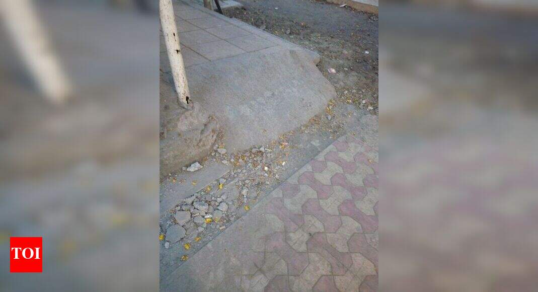Unsafe footpath. - Times of India