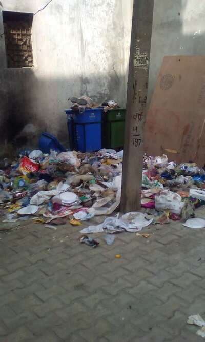 Overflowing dustbins - Times of India
