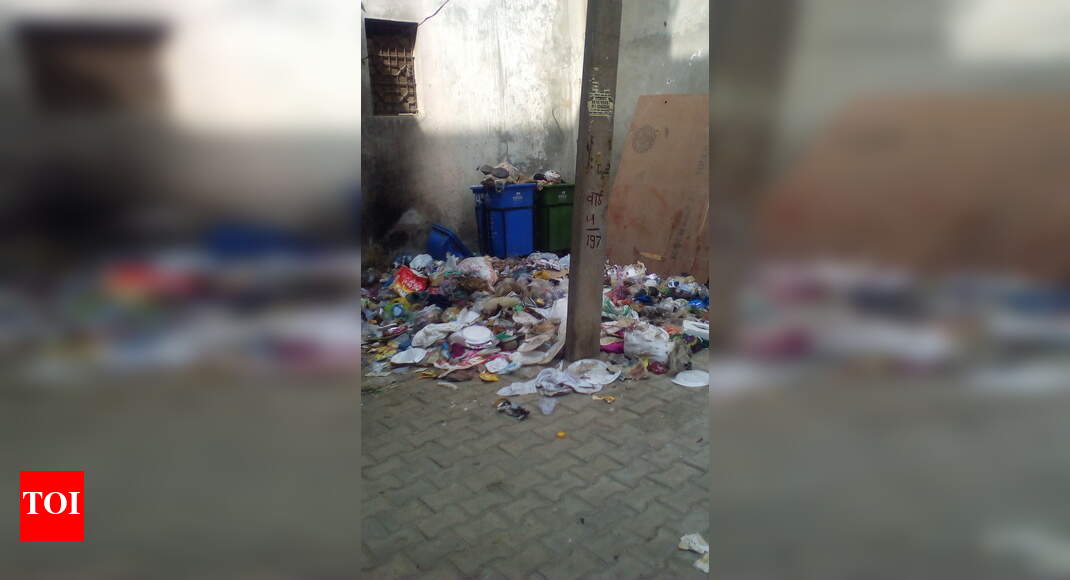 Overflowing dustbins - Times of India