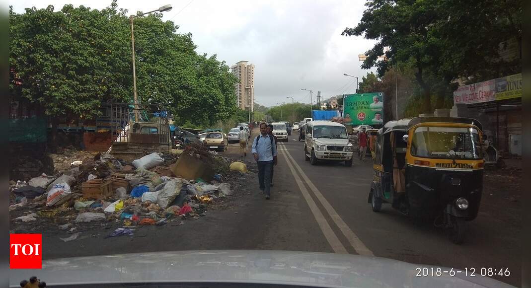 Garbage blocking the Road - Times of India
