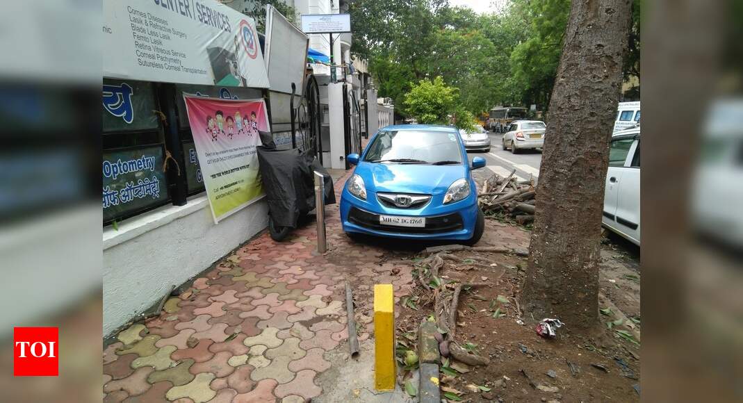 vehicle parked on footpath - Times of India