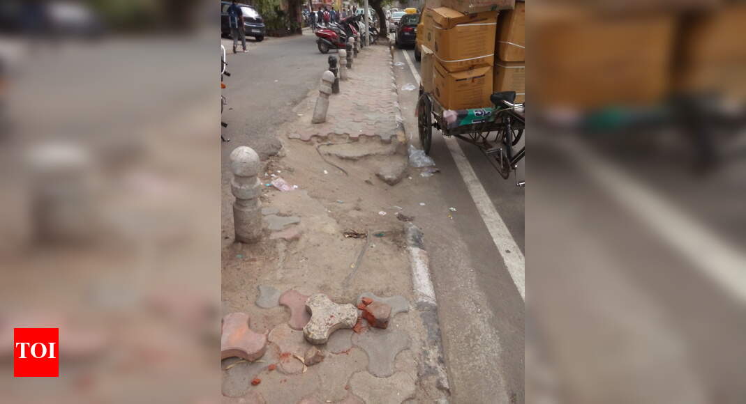 Footpath broken - Times of India
