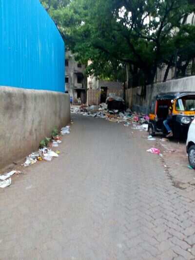open garbage on road - Times of India