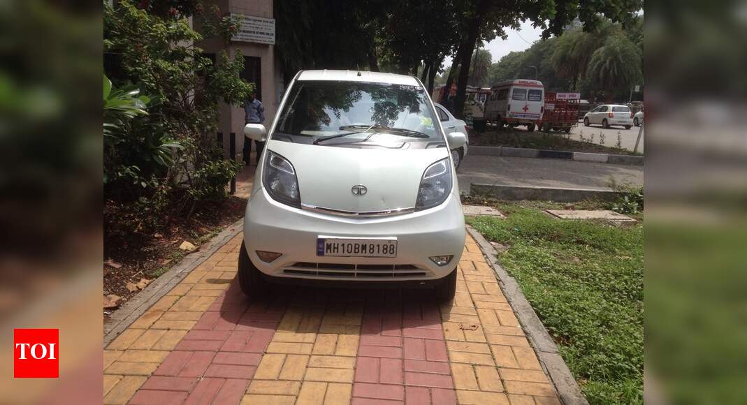 driving and parking on footpath - Times of India