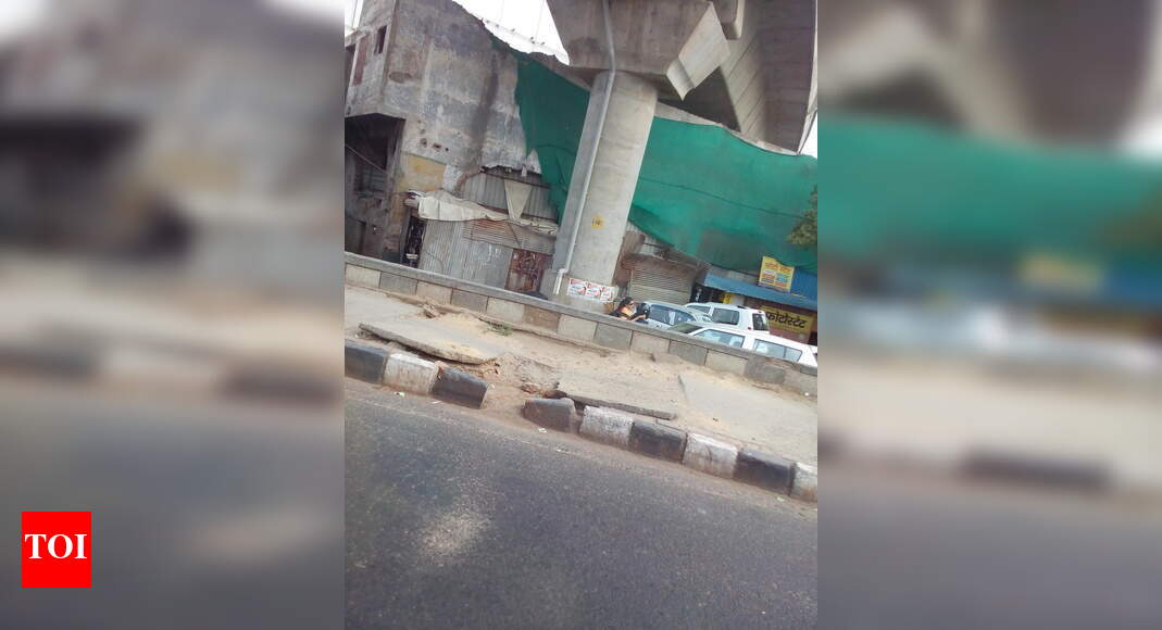 Broken footpath - Times of India