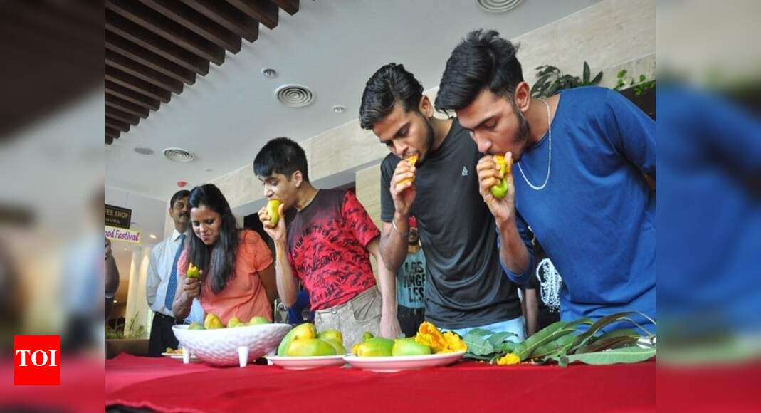 Mango eating competition held | Events Movie News - Times of India