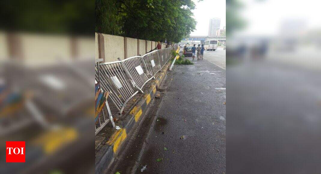 Damaged electric pole and footpath railing - Times of India