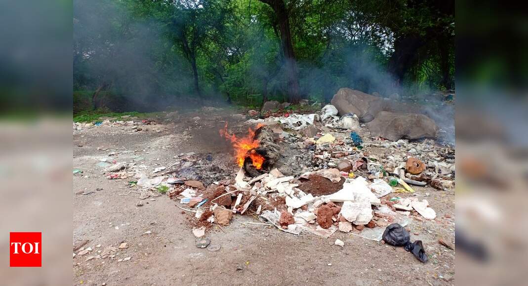 Toxic garbage being burnt - Times of India