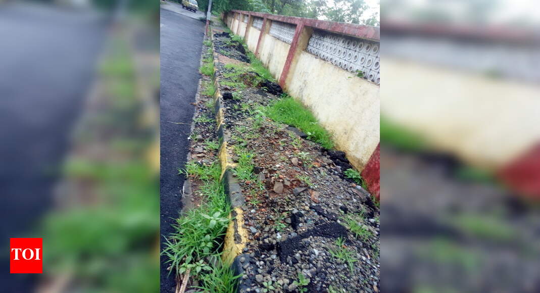 Mud n Tar on footpath - Times of India