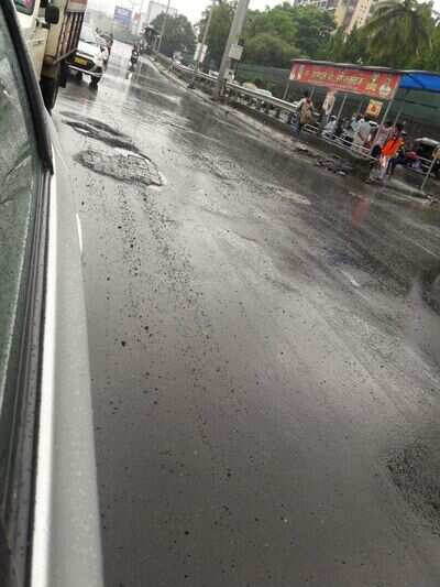 Before Andheri flyover, causing traffic jams - Times of India
