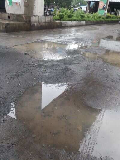Before Andheri flyover, causing traffic jams - Times of India