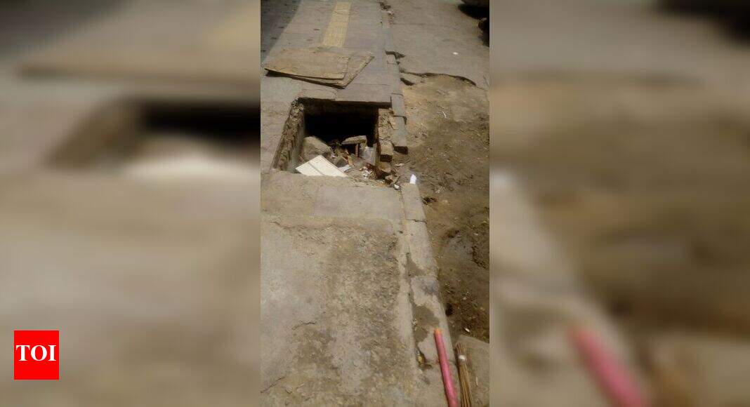 Broken footpath causes injuries - Times of India