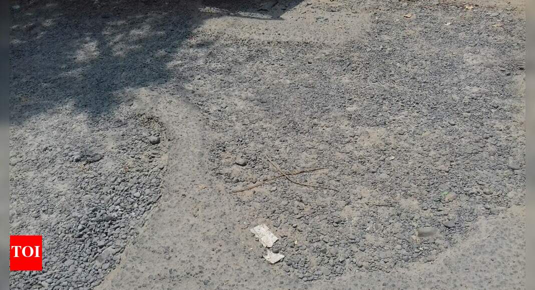 road not repaired - Times of India