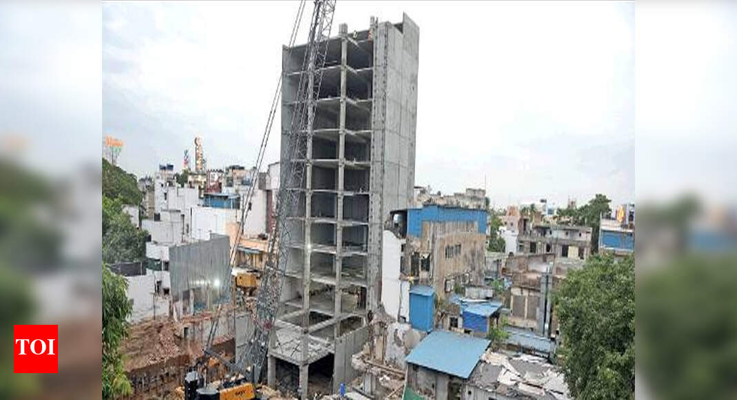 Nine-floor structure on site of razed building one month after permit ...