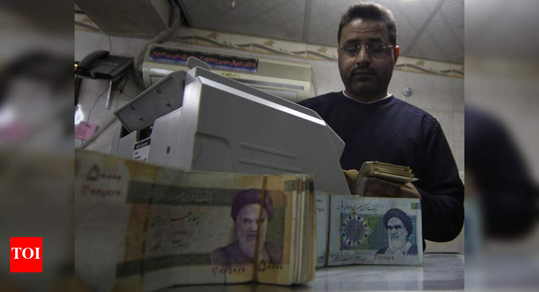 Iran's rial hits record-low 1,00,000 to the dollar - The Times of India