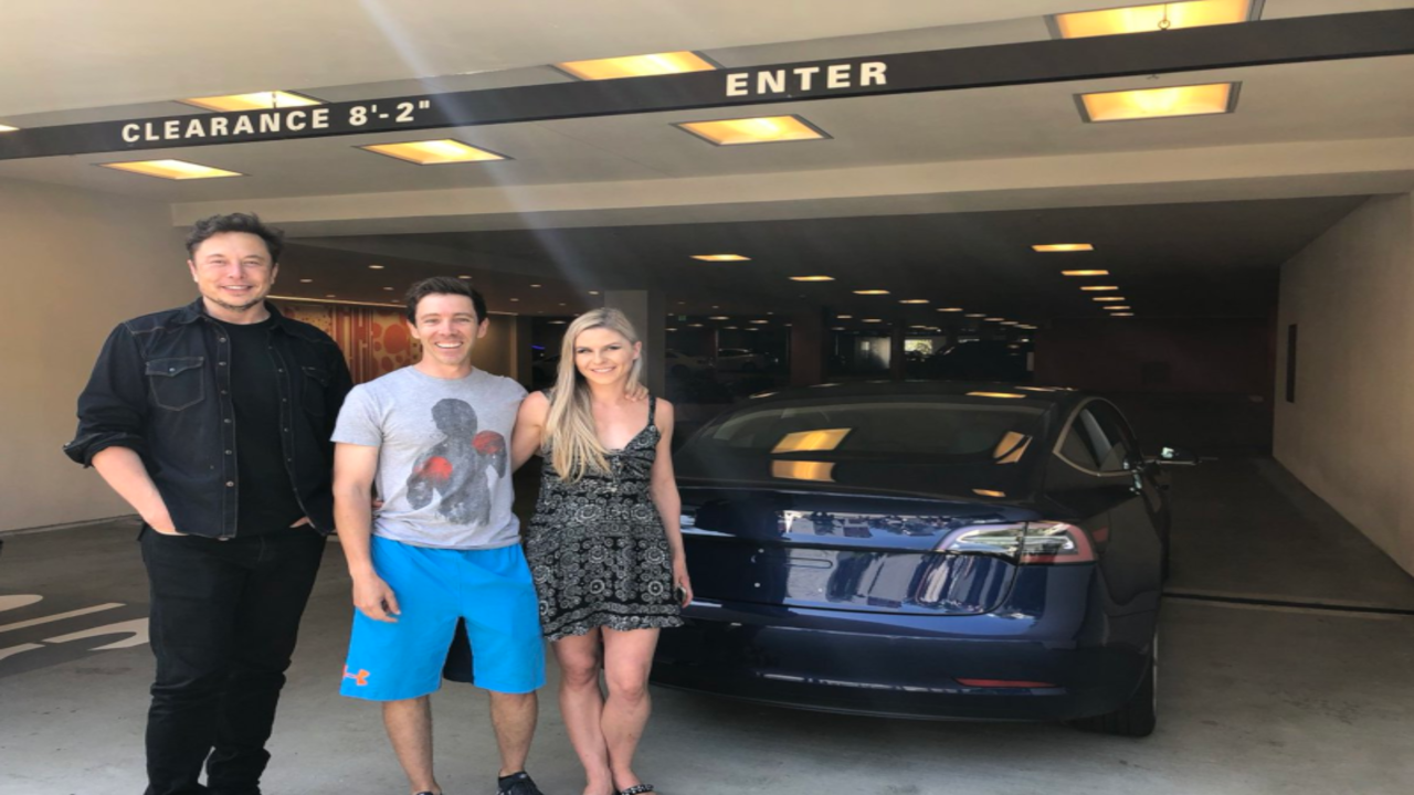 Elon Musk: Tesla chief Elon Musk personally delivers Model 3 to customer