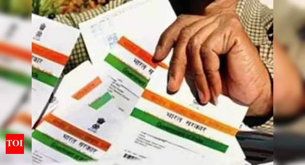 UIDAI helpline no. pops up in phones, courtesy Google - Times of India
