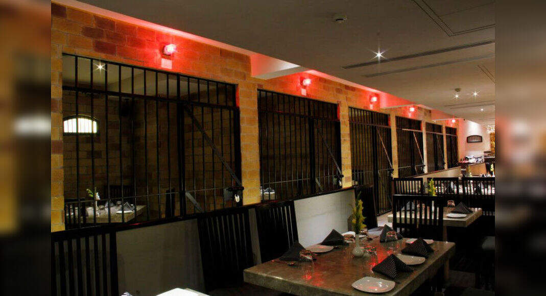A restaurant where jailers take food order, prisoners serve the food ...