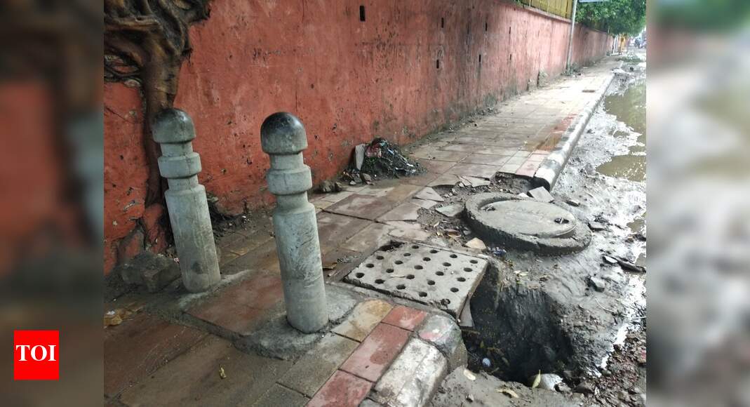 Open drain next to footpath - Times of India