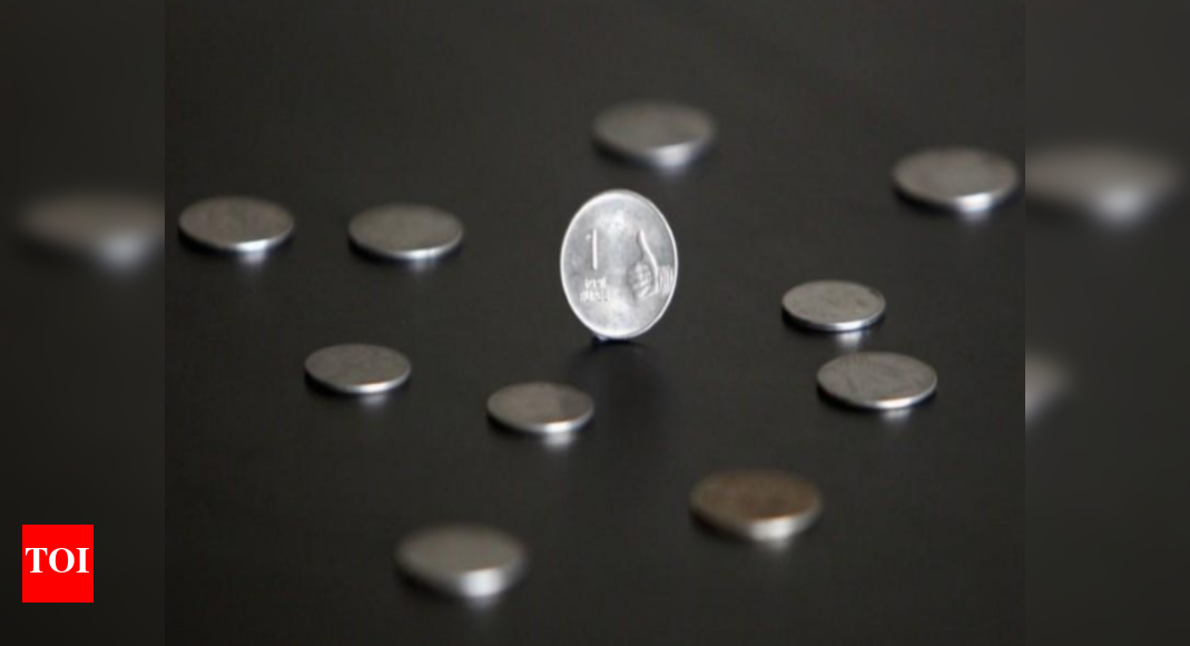 Rupee at 70 against dollar is new normal - Times of India