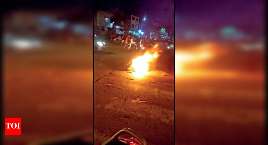 PAAS members take to roads, torch BRTS bus | Rajkot News - Times of India