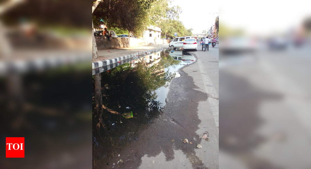 Sewage overflow on road - Times of India