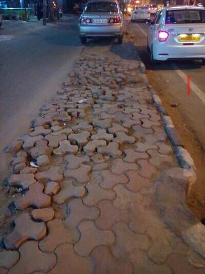 Broken footpath - Times of India
