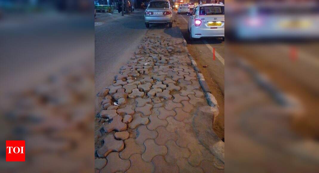 Broken footpath - Times of India